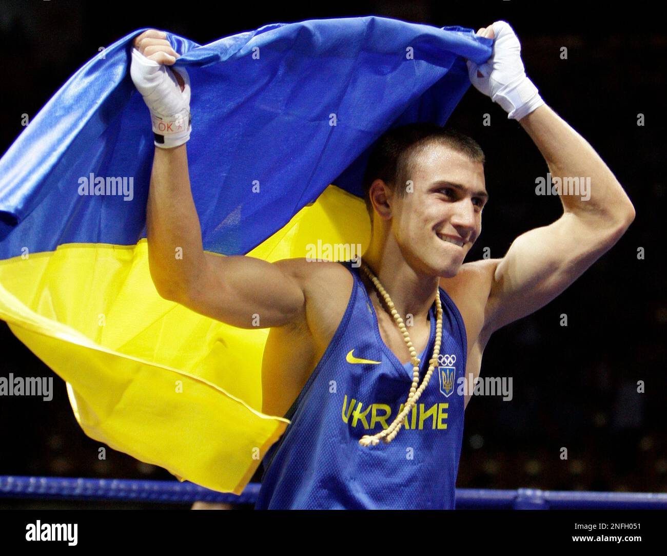 Vasyl Lomachenko of Ukraine reacts after defeating Li Yang of China in ...