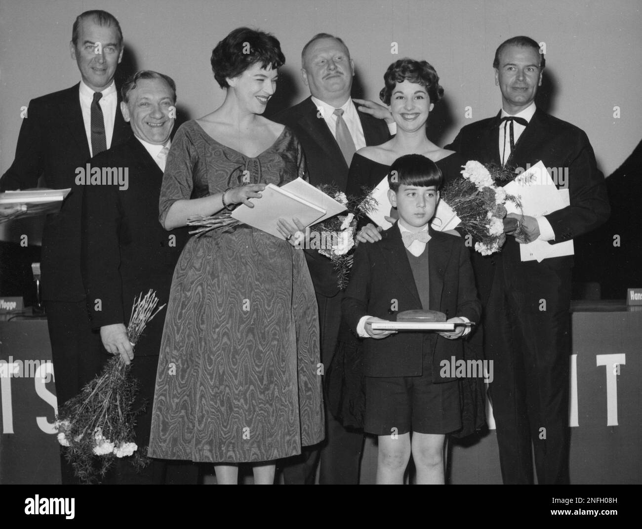 Actors and actresses pose for a family photo after recieving their ...