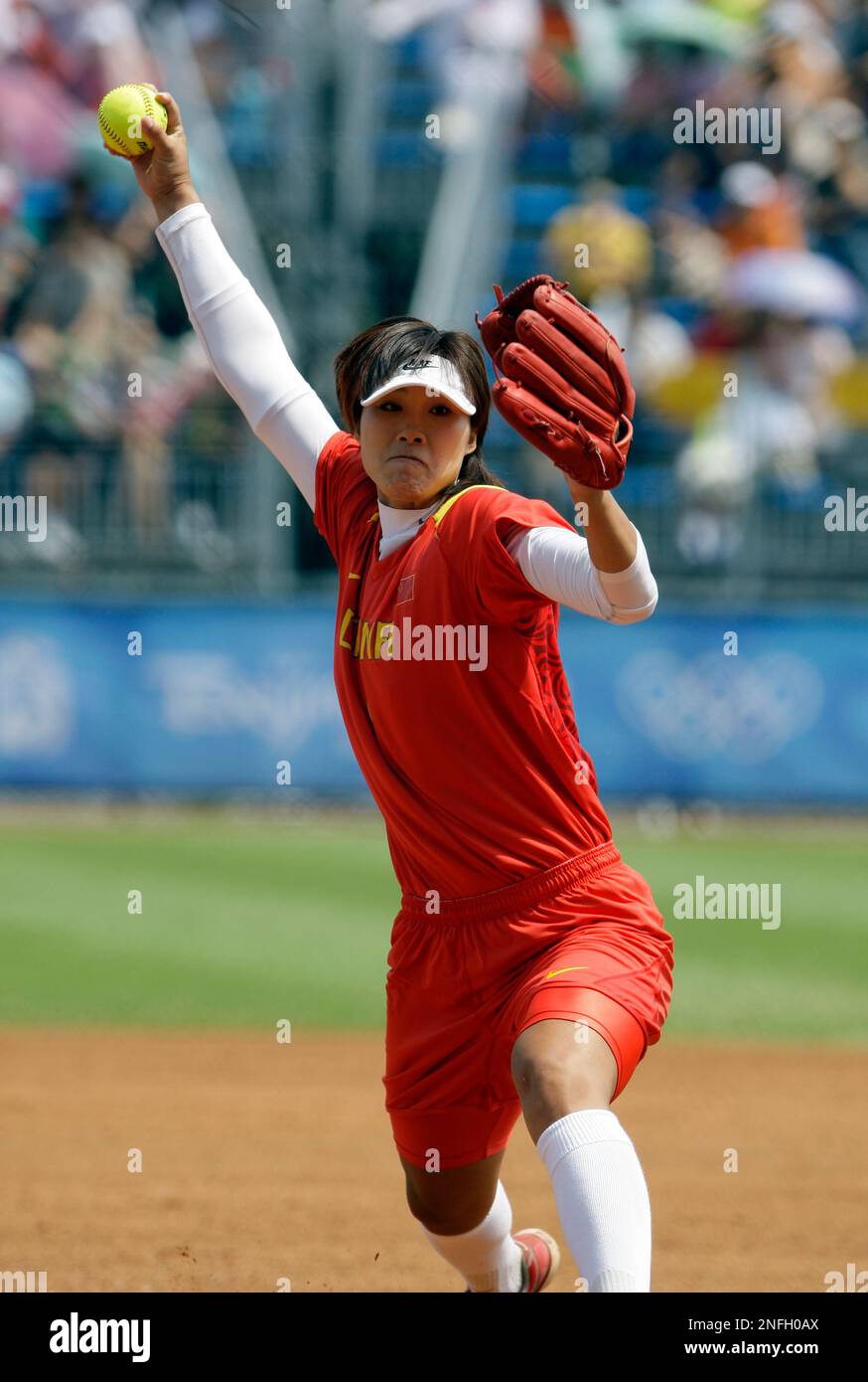 China starting pitcher Lu Wei throws against the U.S. in a softball ...
