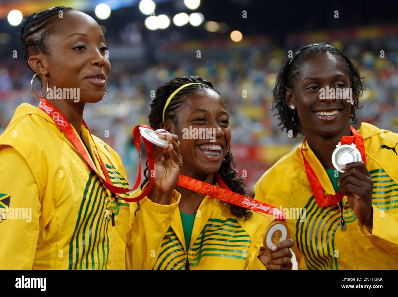 Gold medalist Shelly-Ann Fraser of Jamaica, center, and her silver ...