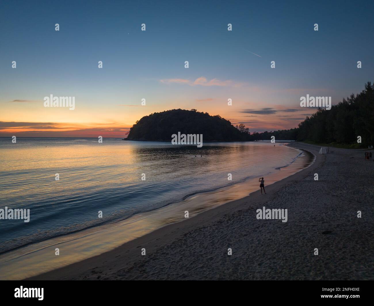 aerial view beautiful sunset above Kala island at Layan beach Phuket ...