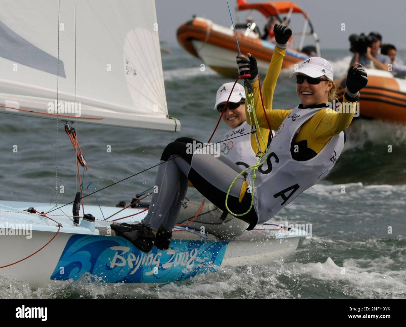 Australia's 470 Women's Elise Rechichi, left, and Tess Parkinson react ...