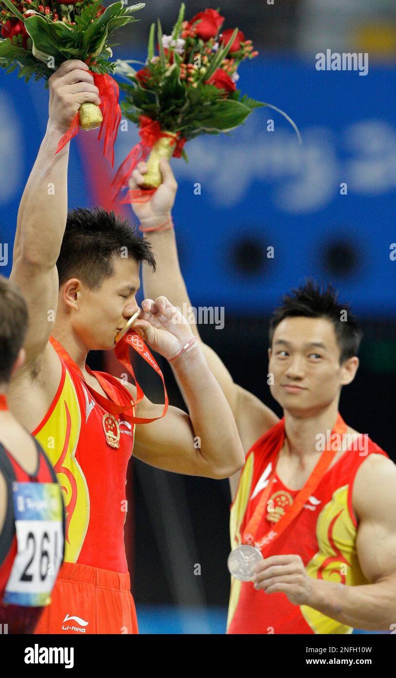 China's gymnasts Chen Yibing, left, and Yang Wei pose with their medals ...
