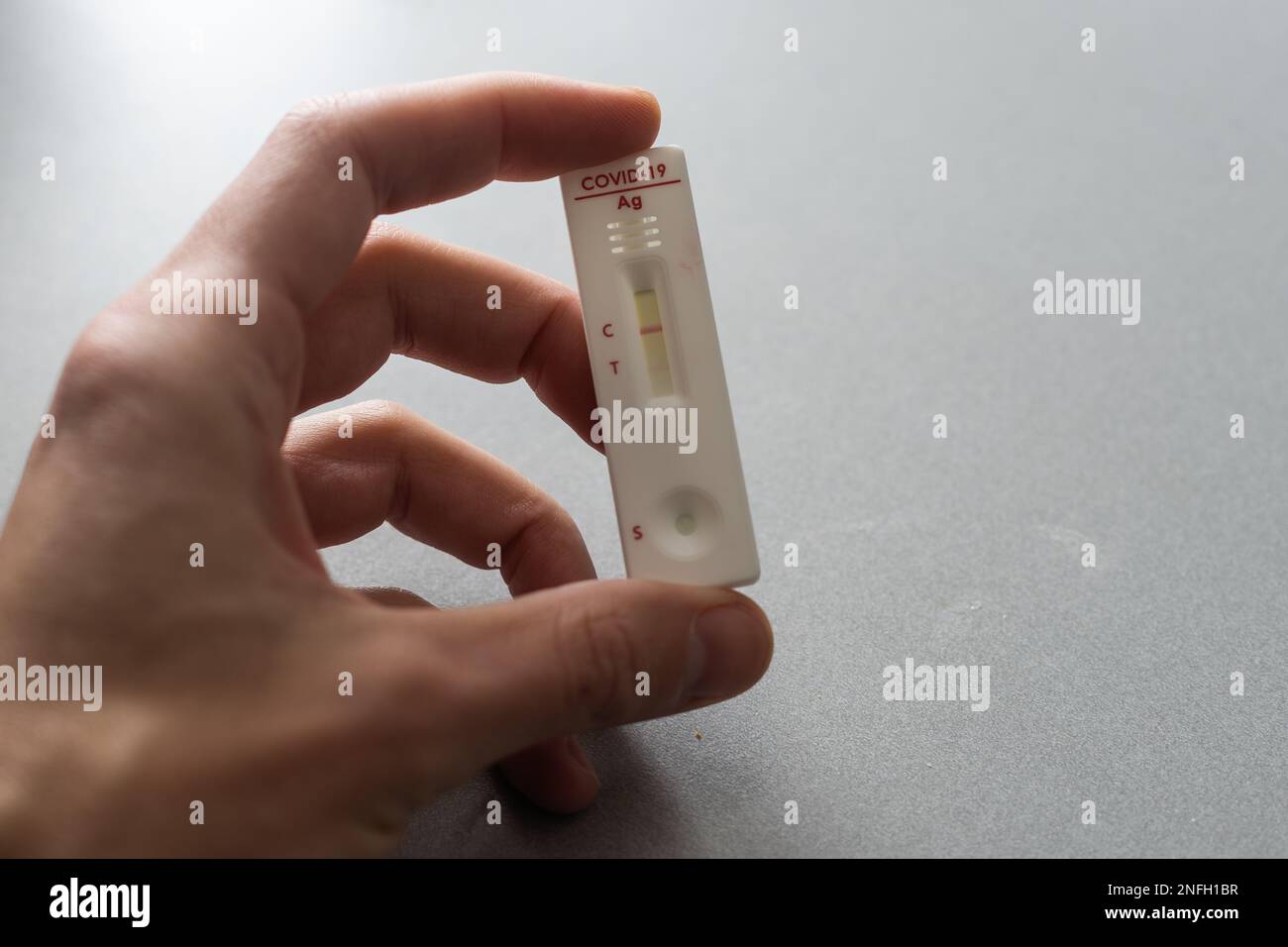 Hand holding rapid Coronavirus Covid-19 negative test device with ...