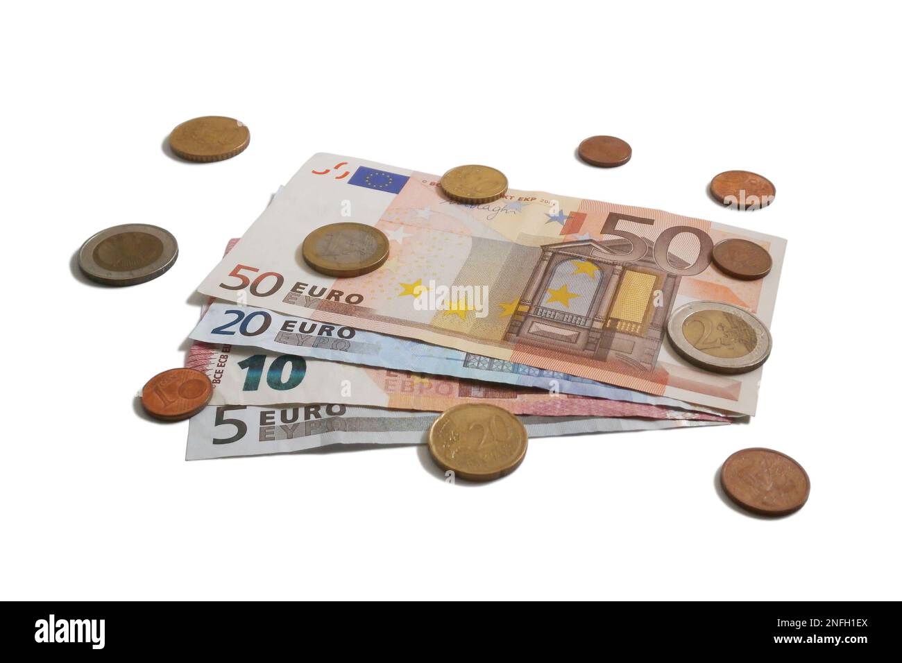 Close-up on a stack of Euros coins and banknotes on white background ...
