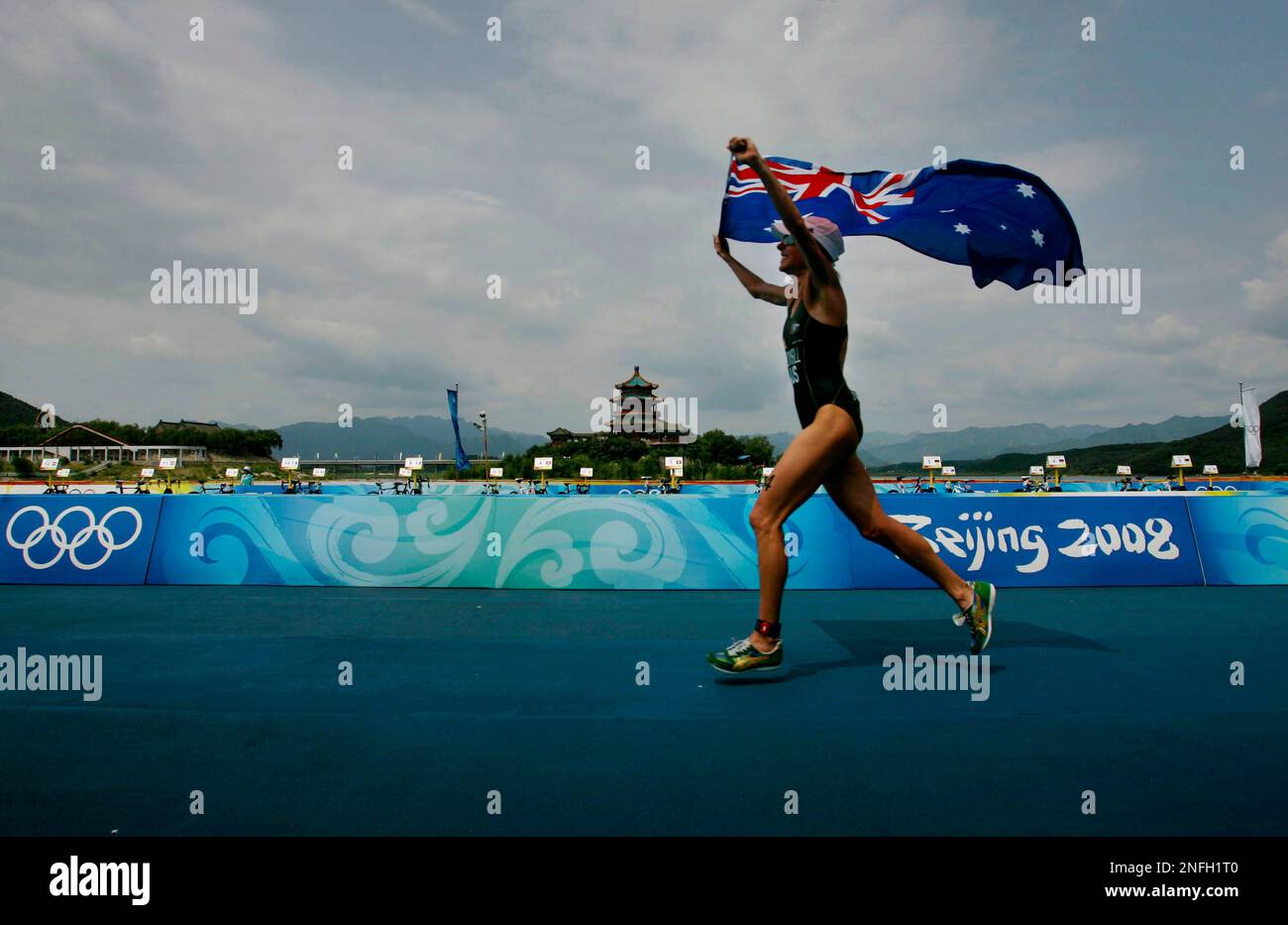 Australian Emma Snowsill waves the Australian National flag as she ...