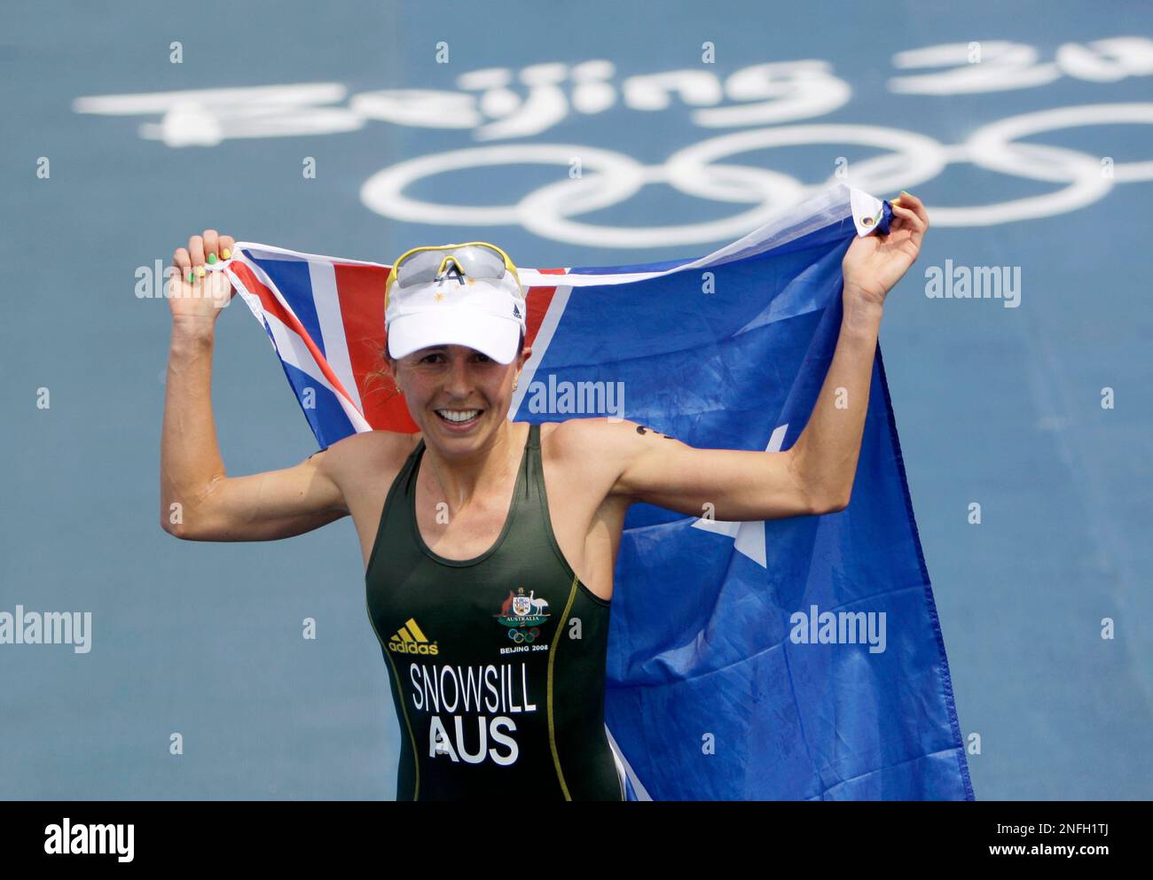 Australia's Emma Snowsill waves her country's national flag after ...