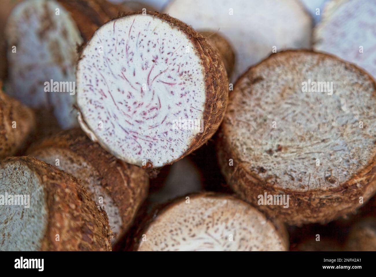 Full frame close-up on a stack of taro on a market stall Stock Photo ...