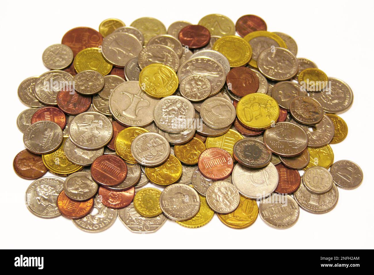 Close-up on a stack of international coins on white background Stock ...