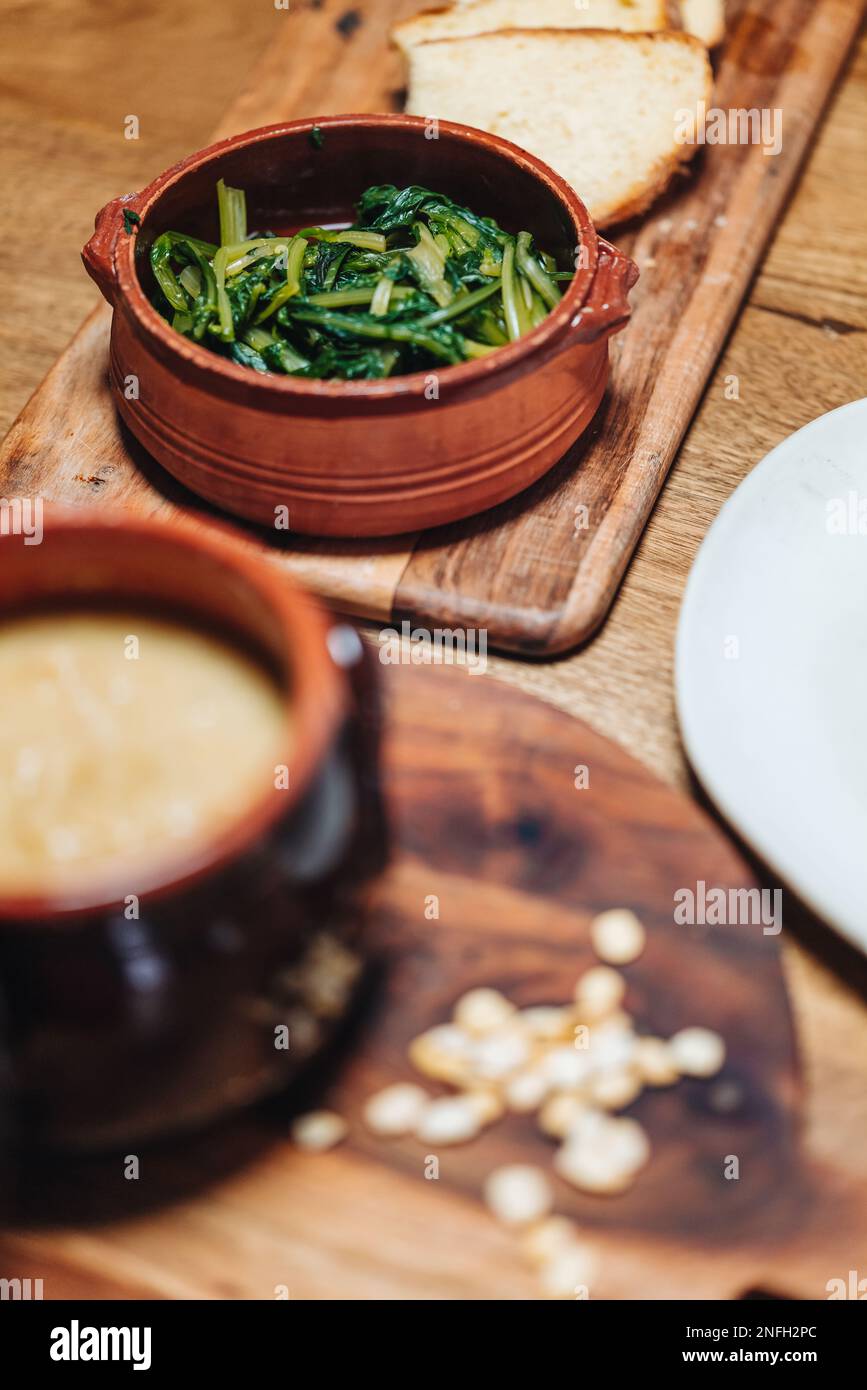 Traditional chicory and fava beans meal from Puglia, Italy Stock Photo ...