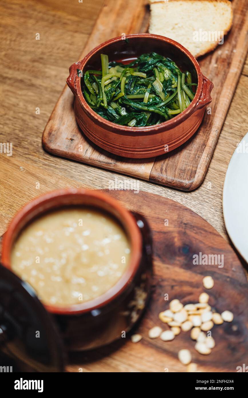 Traditional chicory and fava beans meal from Puglia, Italy Stock Photo ...
