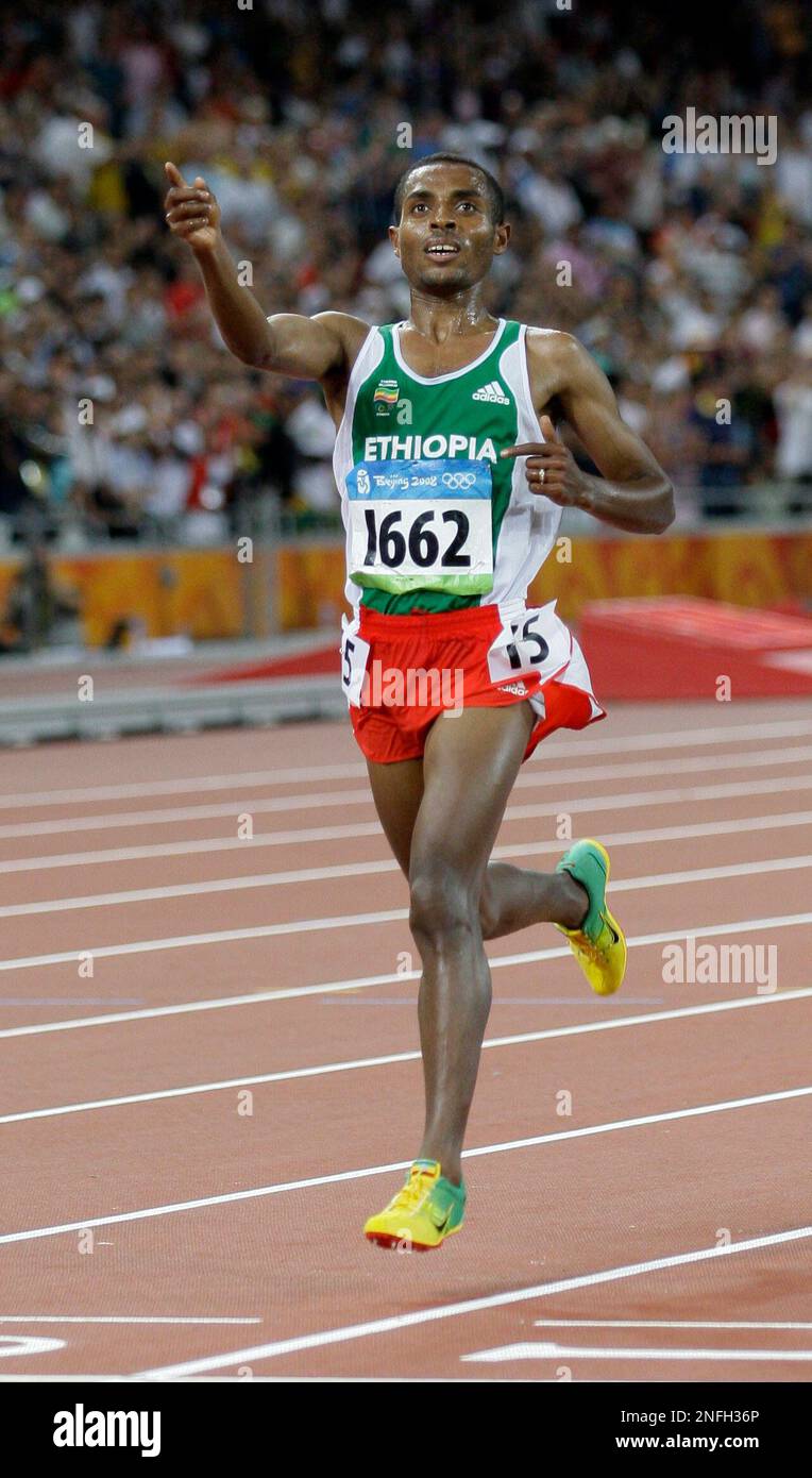 Ethiopia's Kenenisa Bekele crosses the line to win the gold in the men ...