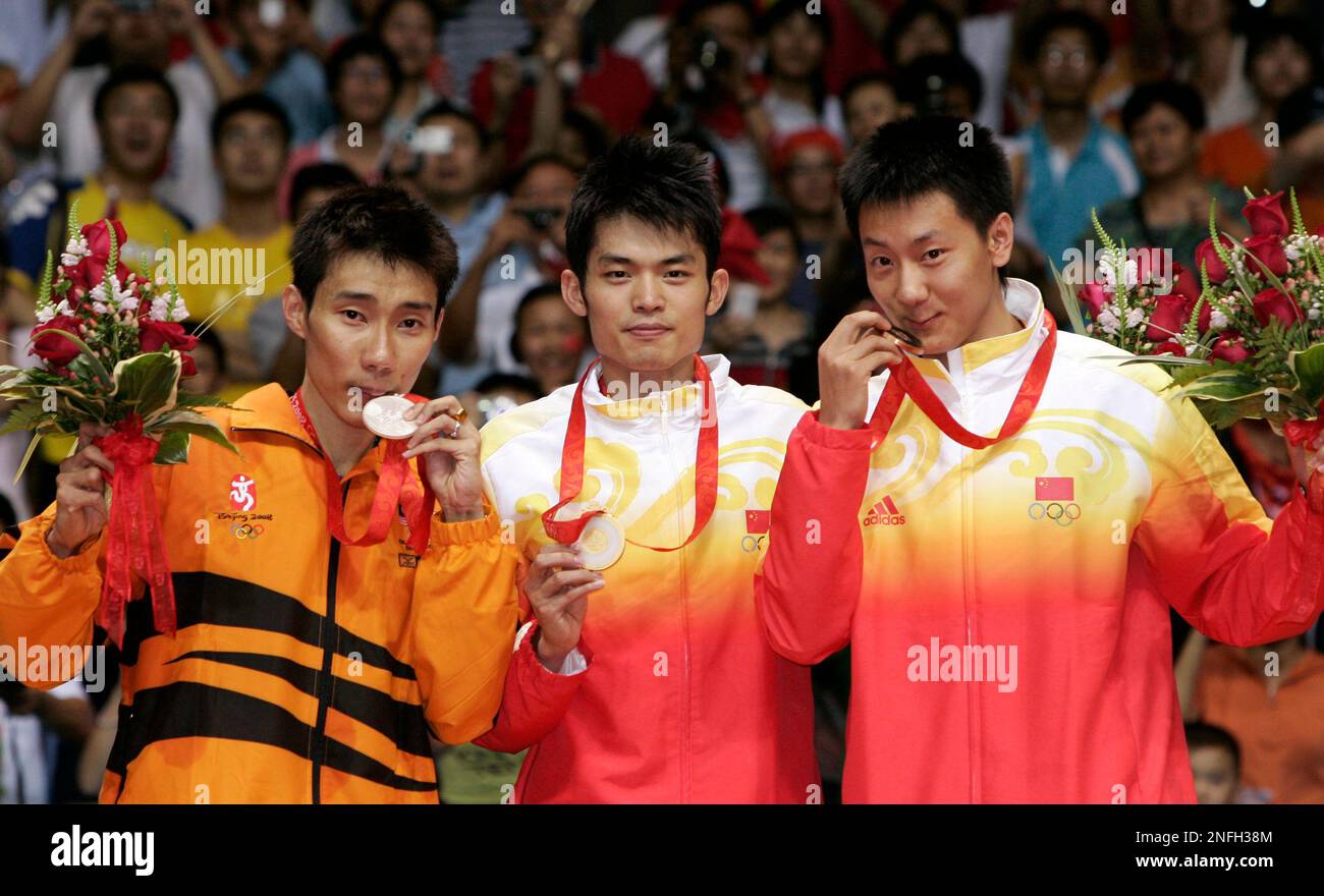 From left, silver medalist Lee Chong Wei of Malaysia, gold medalist Lin Dan of China, and bronze ...