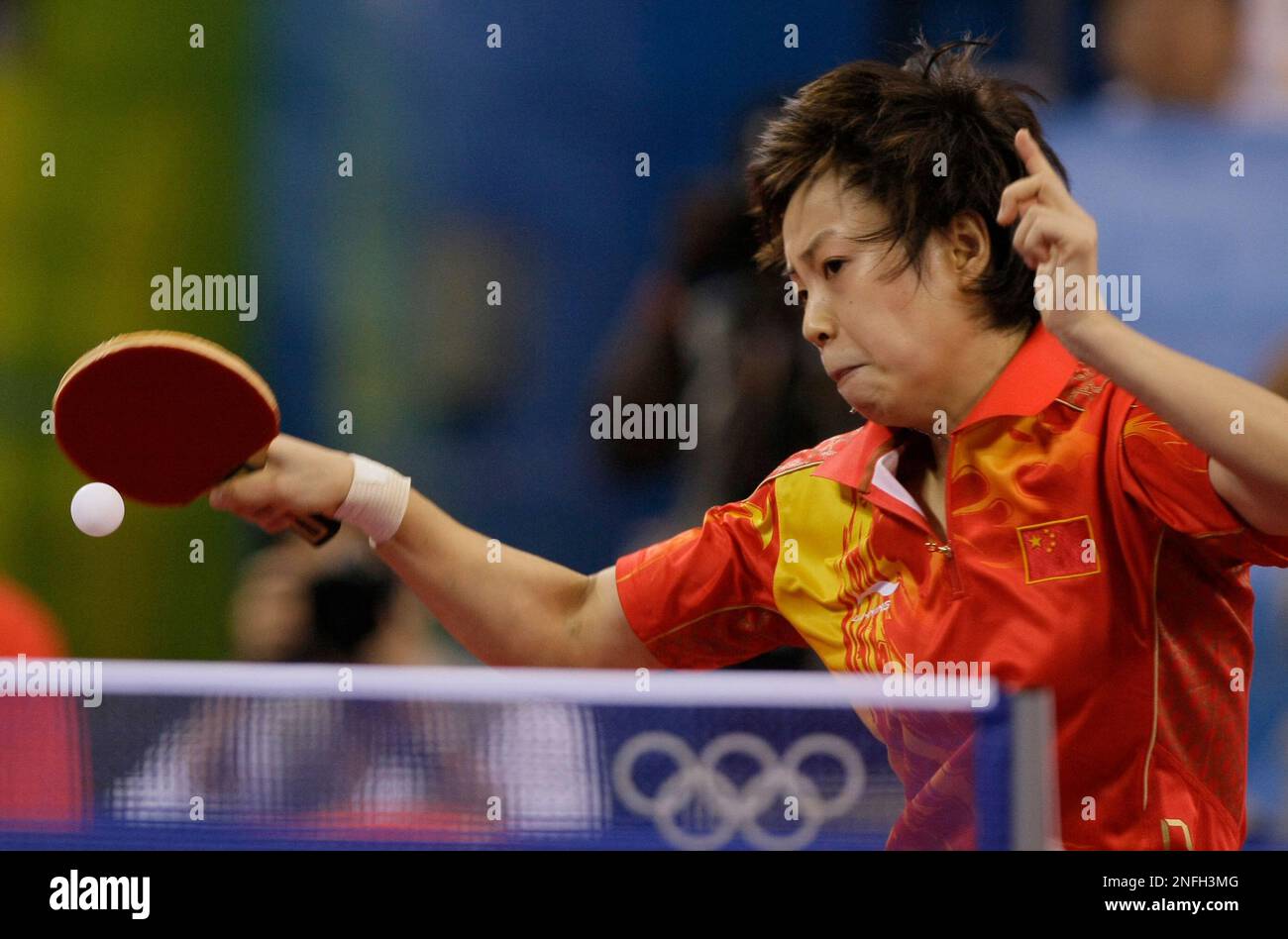 China's Zhang Yining returns a ball in the women's table tennis team ...