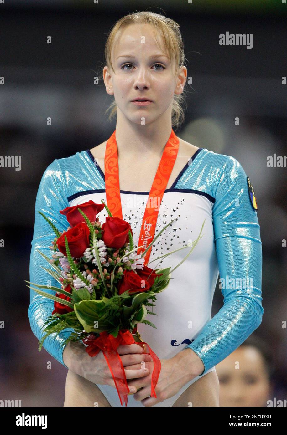 Gold medal winner gymnast Sandra Izbasa from Romania poses with her ...