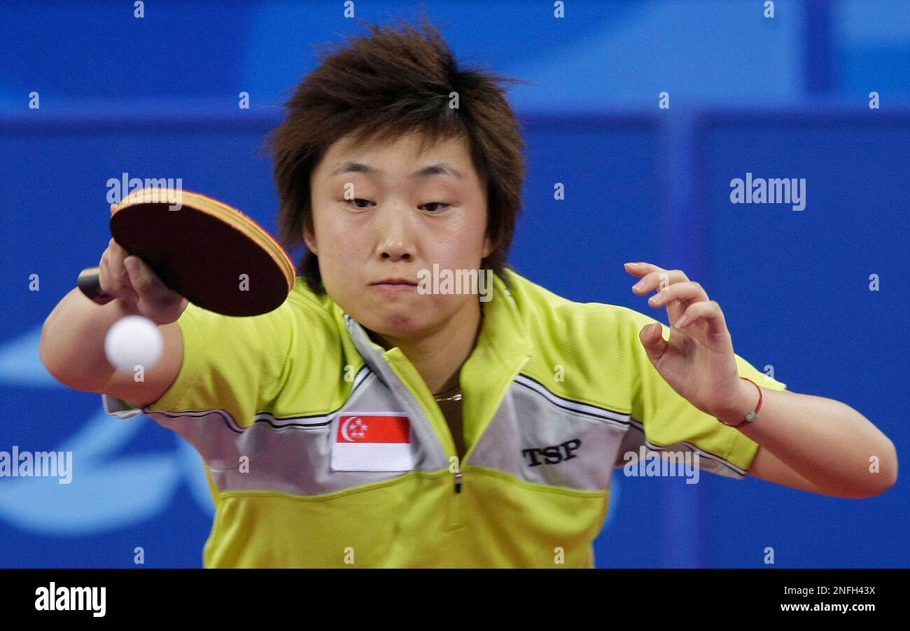 Singapore's Feng Tianwei returns a shot by China's Wang Nan during the ...