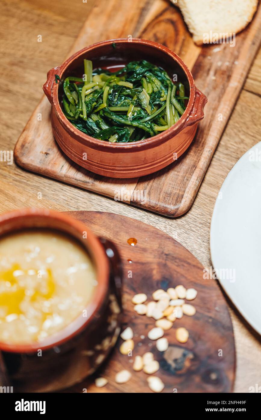 Traditional chicory and fava beans meal from Puglia, Italy Stock Photo ...