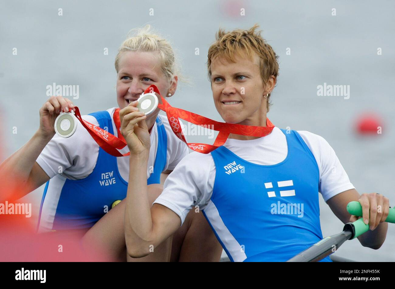 Finland's Minna Nieminen, right, and Sanna Sten display their medals ...