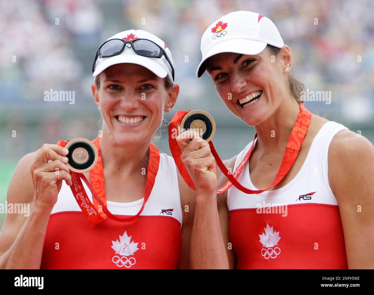 Canada's Melanie Kok, left, and Tracy Cameron celebrate with medals ...