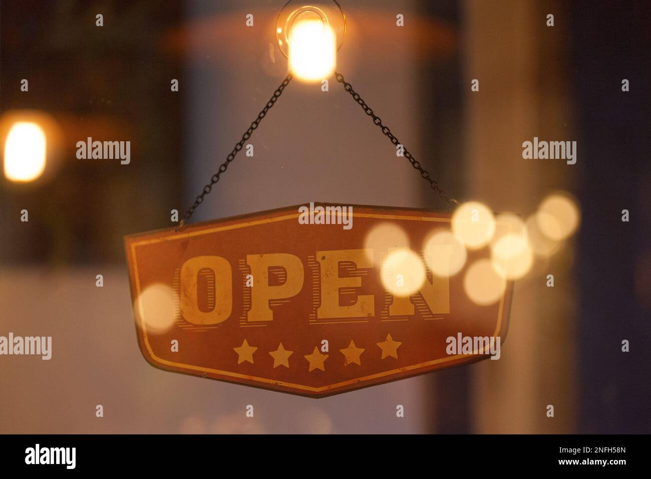 Old fashioned sign in the window of a shop saying in "Open Stock Photo ...