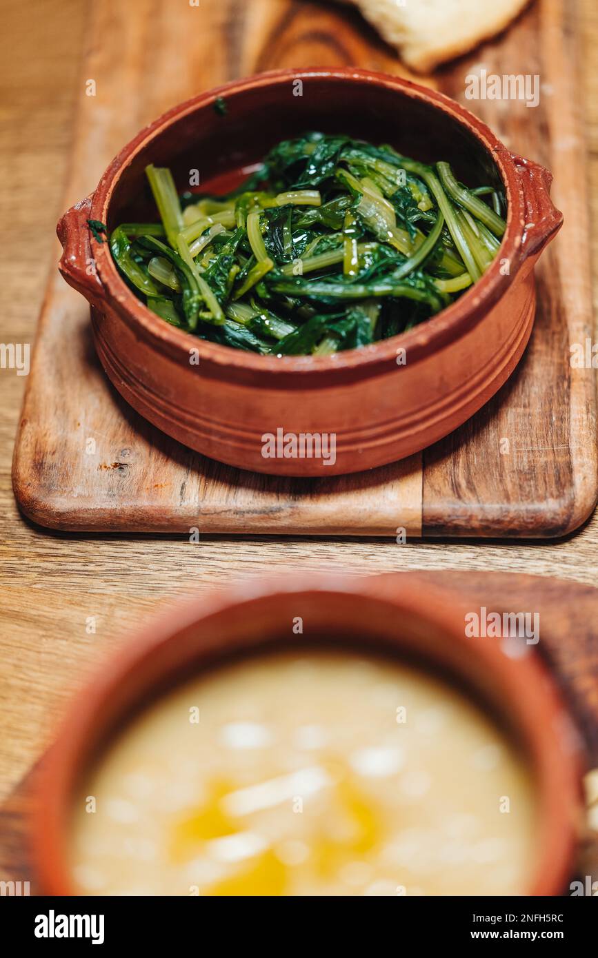 Traditional chicory and fava beans meal from Puglia, Italy Stock Photo ...