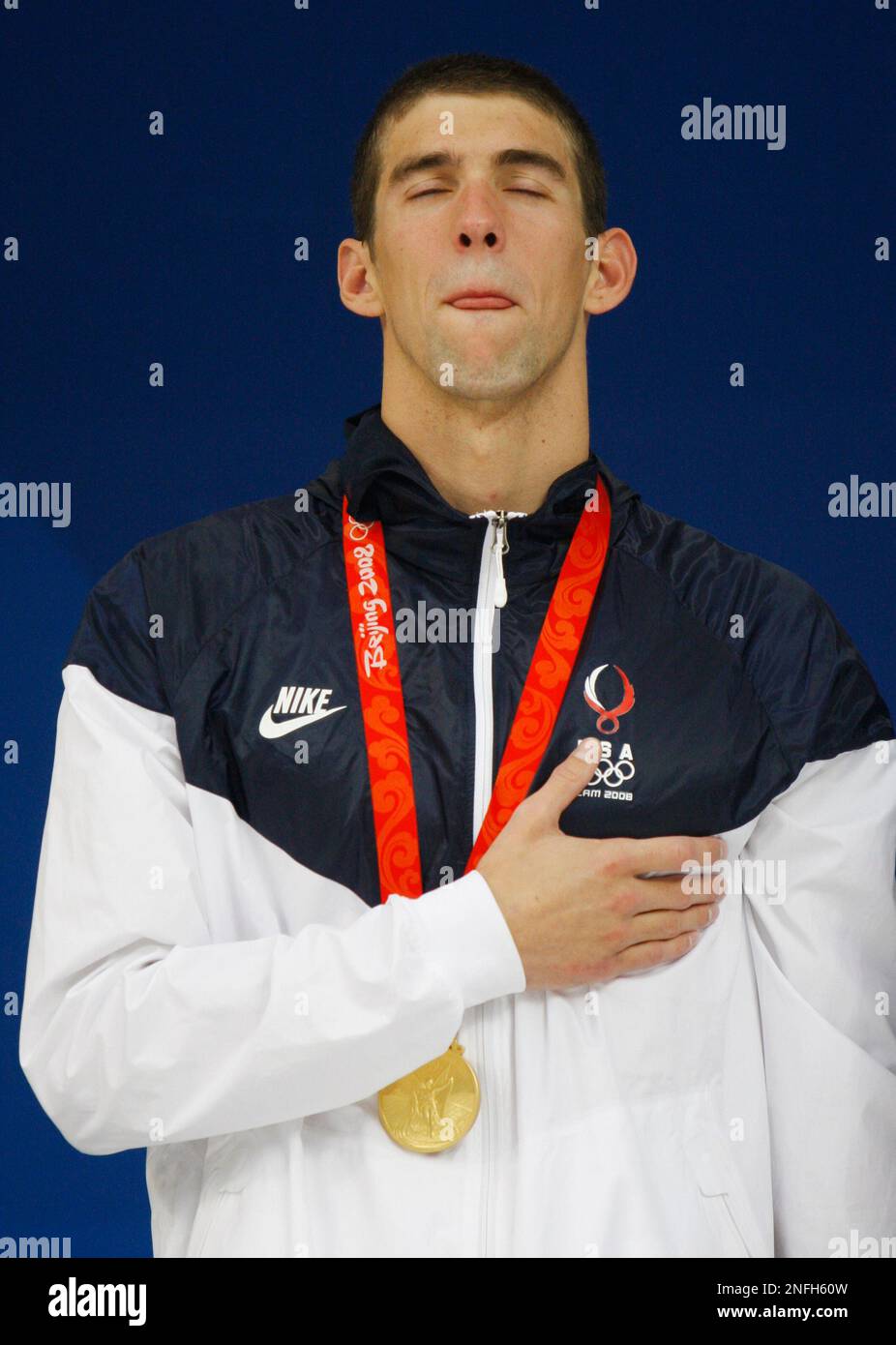 The United States' Michael Phelps reacts on the podium after receiving ...