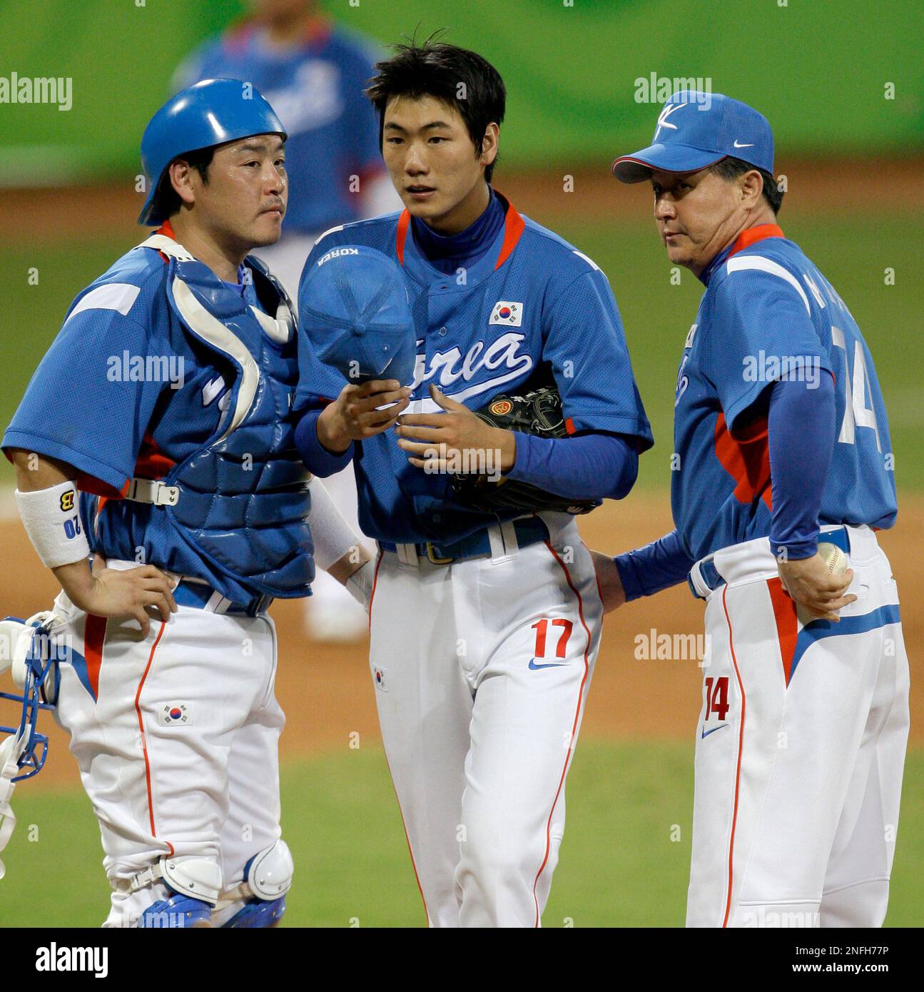 South Korea's Kim Kyungmoon removes pitcher Kim Kwanghyun center, from ...