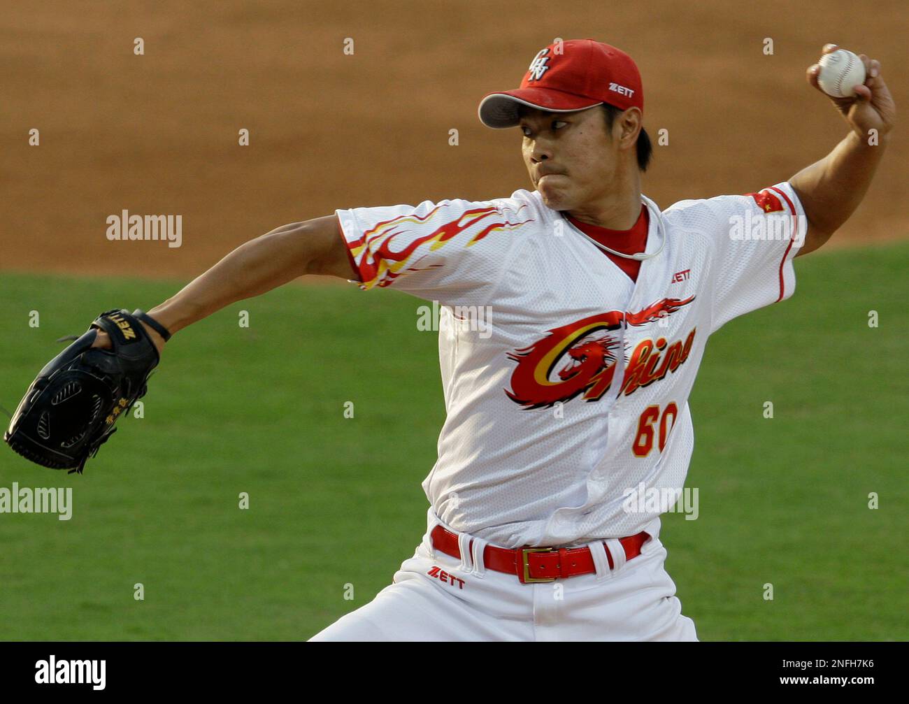 China's starting pitcher Li Weilang prepares to throw against the ...