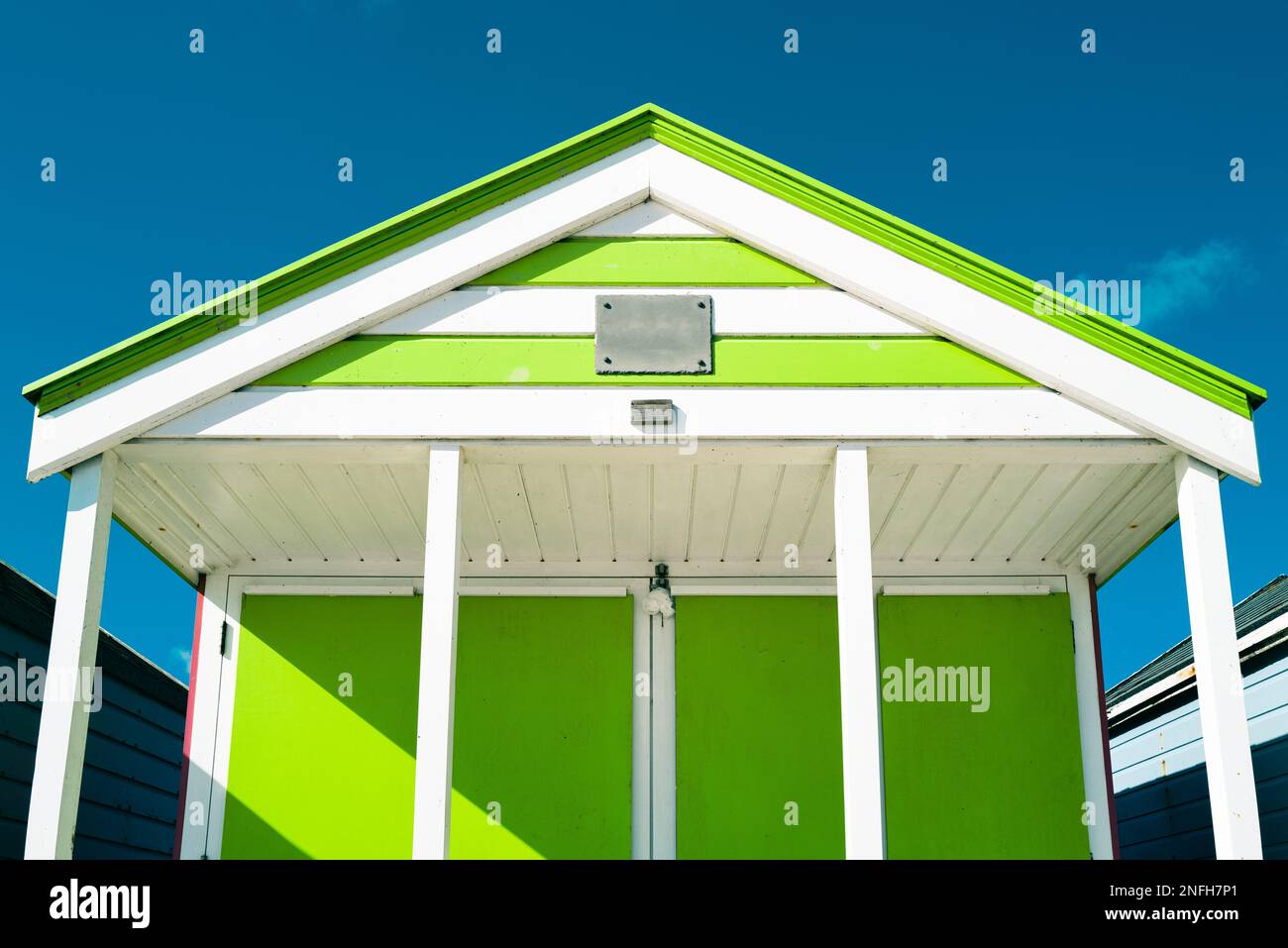 Bright colours seen on a seaside beach hut seen at a famous Suffolk ...