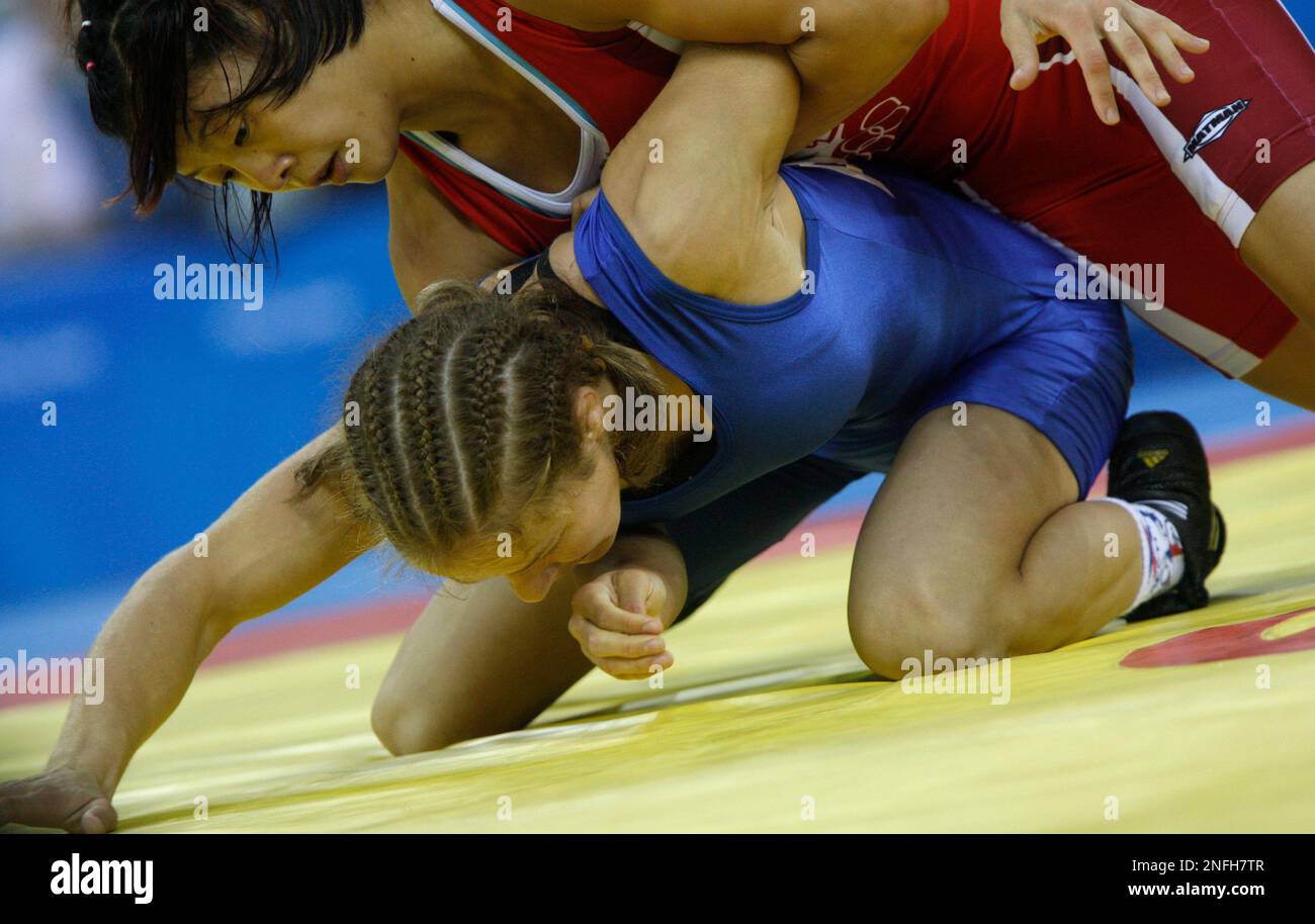 Canada's Carol Hyunh wearing red and Azerbaijan's Mariya Stadnik ...
