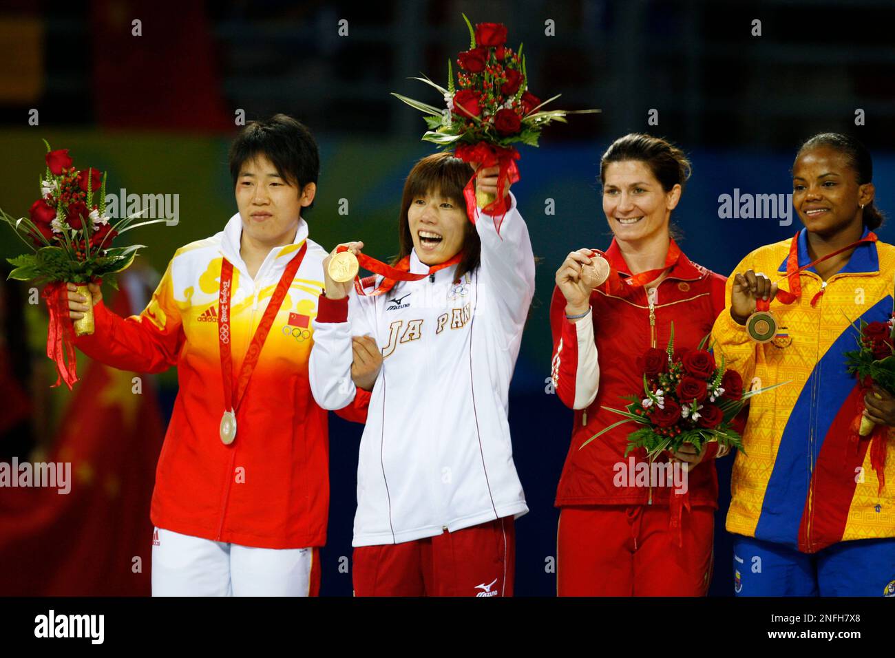 From left, China's Xu Li, silver winner, Saori Yoshida of Japan, gold ...