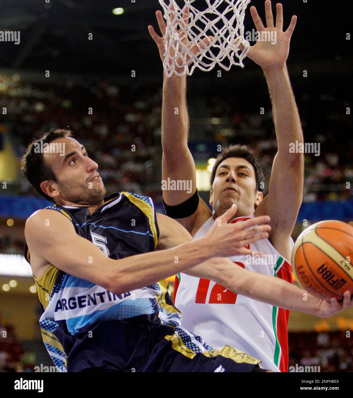Argentina's Manu Ginobili, left, of the NBA's San Antonio Spurs goes ...