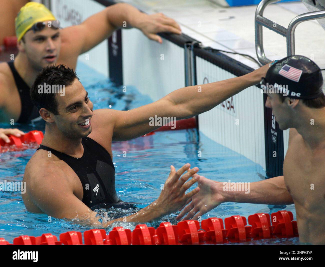 United States' Michael Phelps, right, shakes hand with Serbia's Milorad ...
