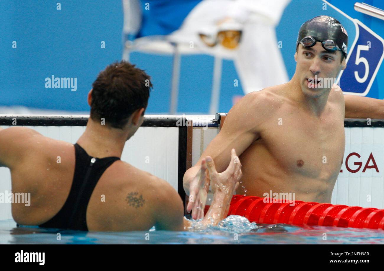 Gold medalist United States' Michael Phelps, right, greets Serbia's ...