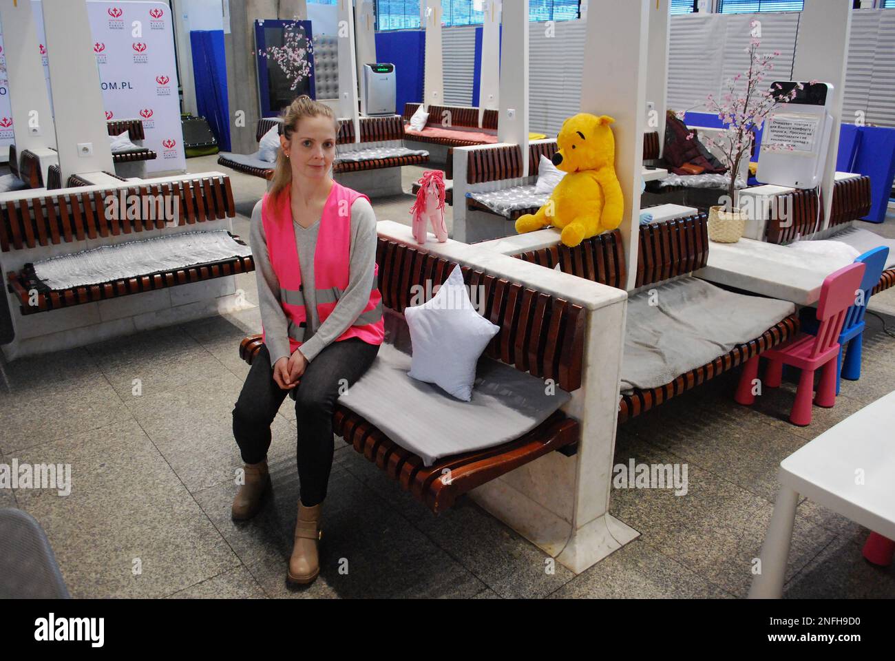 Iryna Michyna poses as she puts together makeshift beds for children ...