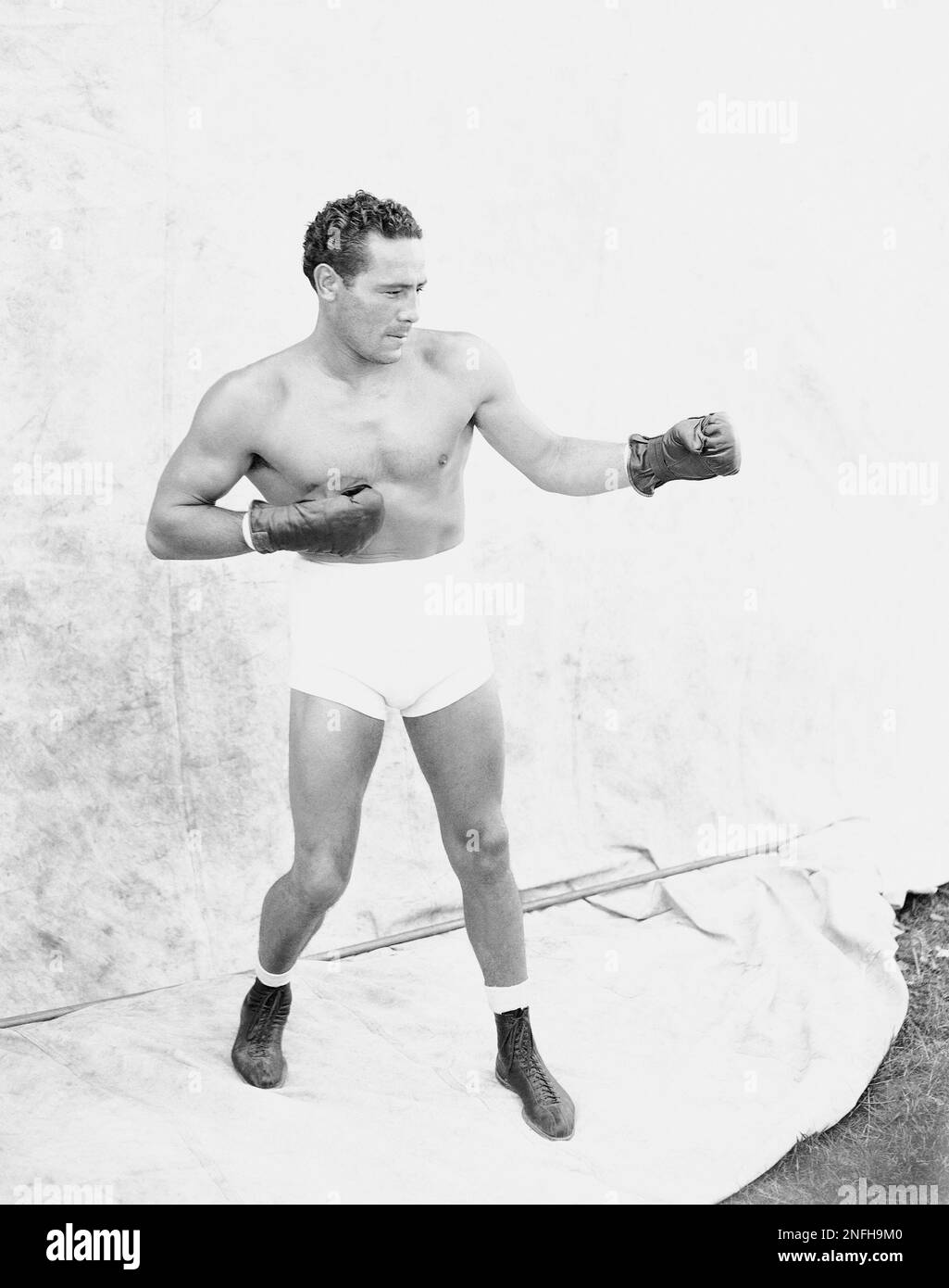 Max Baer in a fighting pose Sept. 21, 1935 as he tapered off his ...