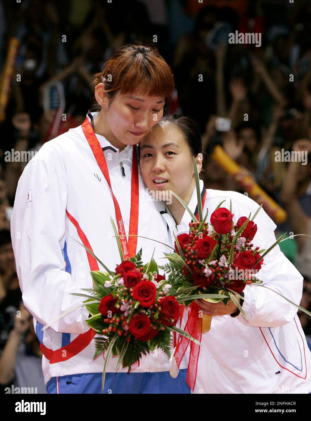 South Korea's Lee Hyo-jung, left, and Lee Kyung-won comfort each other ...