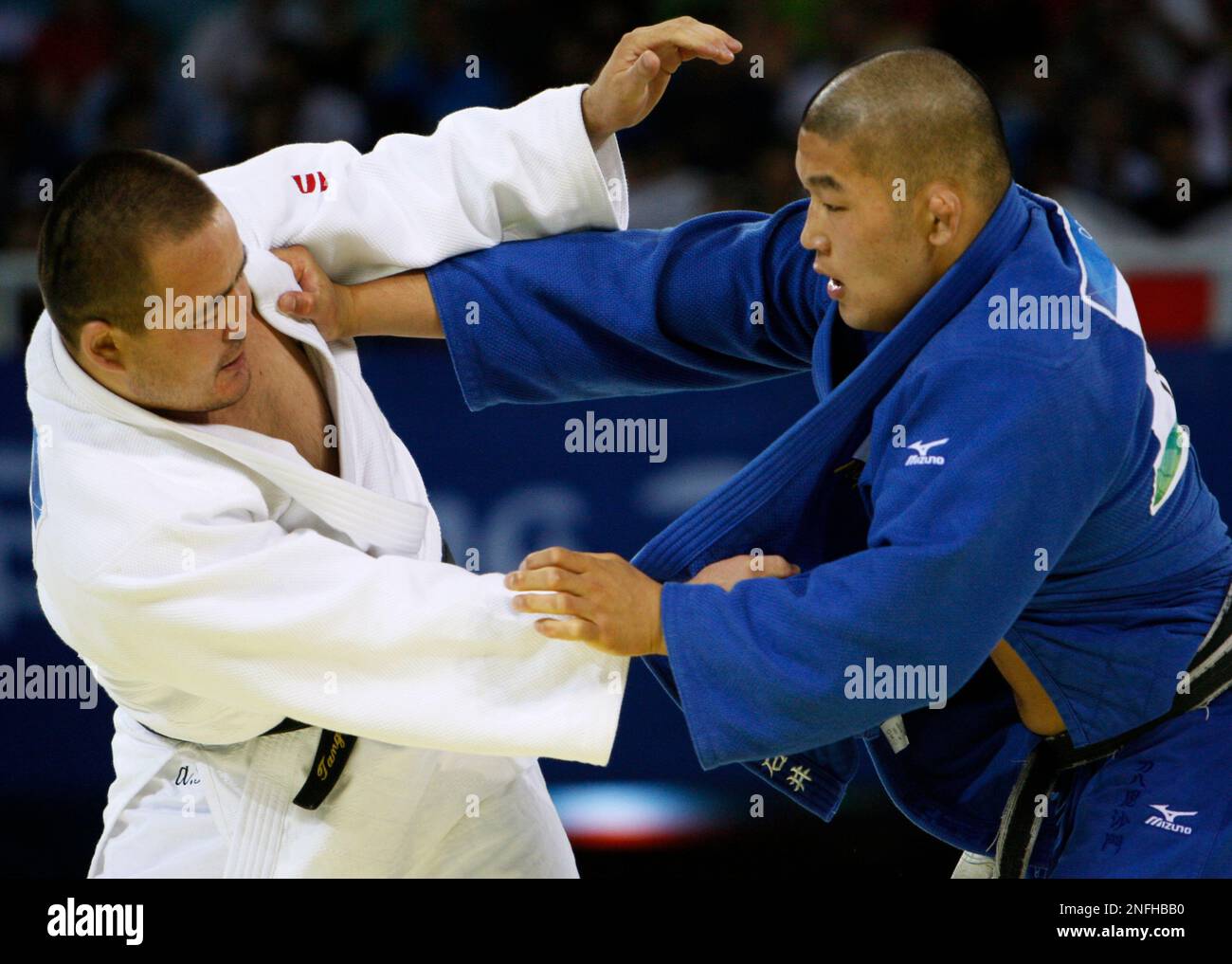 Satoshi Ishii of Japan, blue, and Abdullo Tangriev of Uzbekistan fight ...