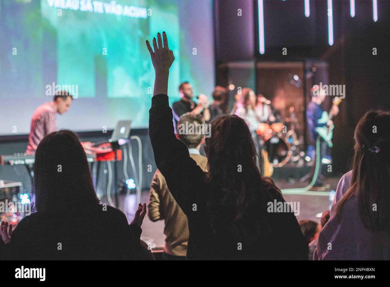 Hands in the air of a woman who praise God at church service Stock ...