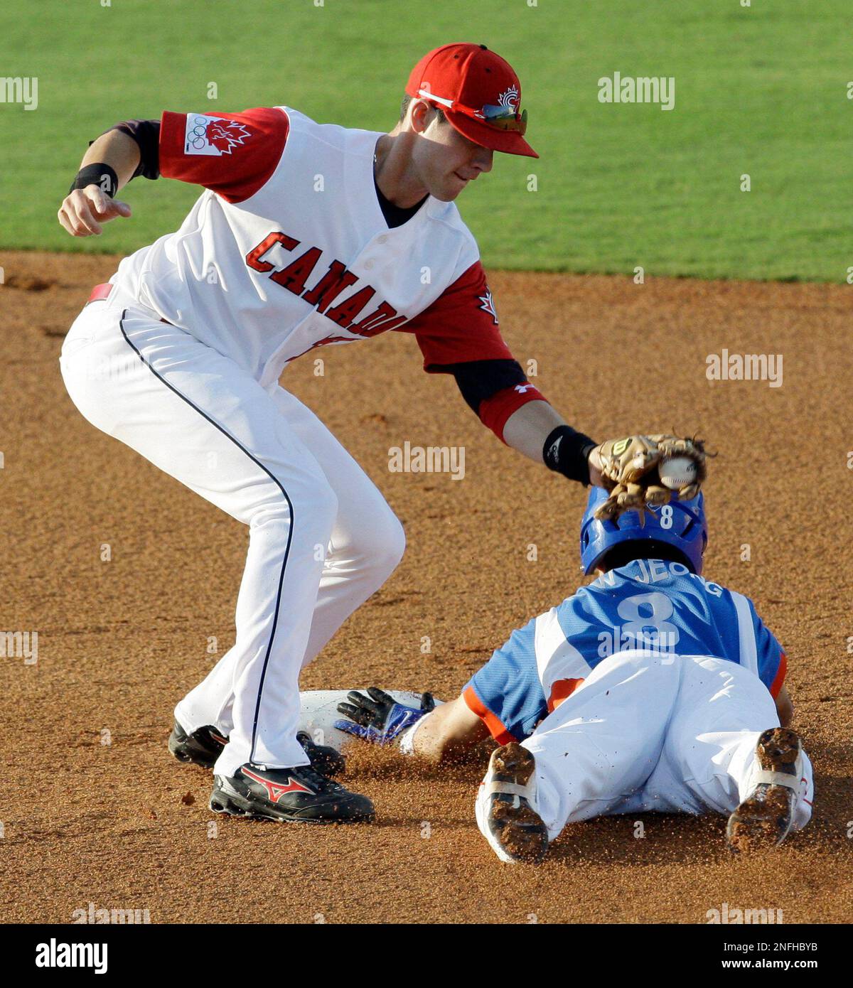 South Korea's Jeong Keun-woo steals second beneath Canada's shortstop ...