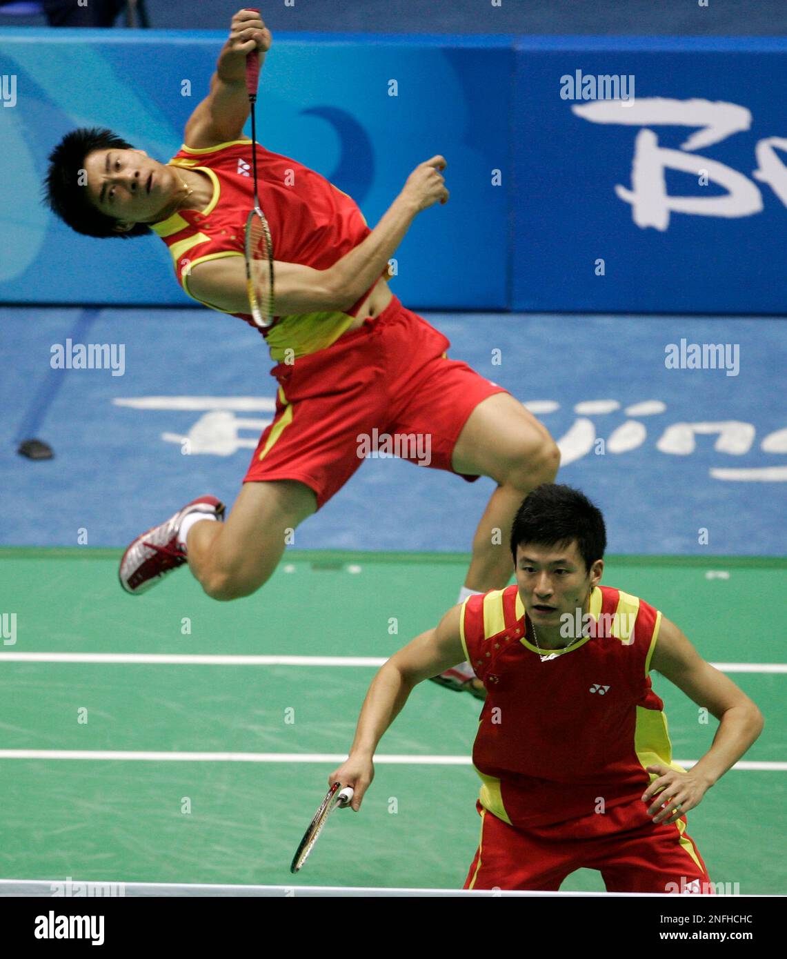 China's Cai Yun, bottom, and Fu Haifeng compete against South Korea's Lee Jae-jin and Hwang Ji ...