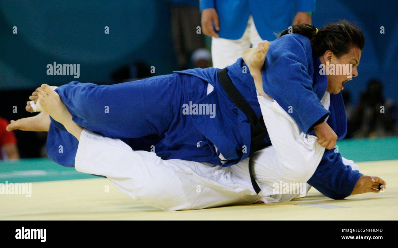 Mexico's Vanessa Zambotti, blue, and Britain's Karina Bryant compete at ...