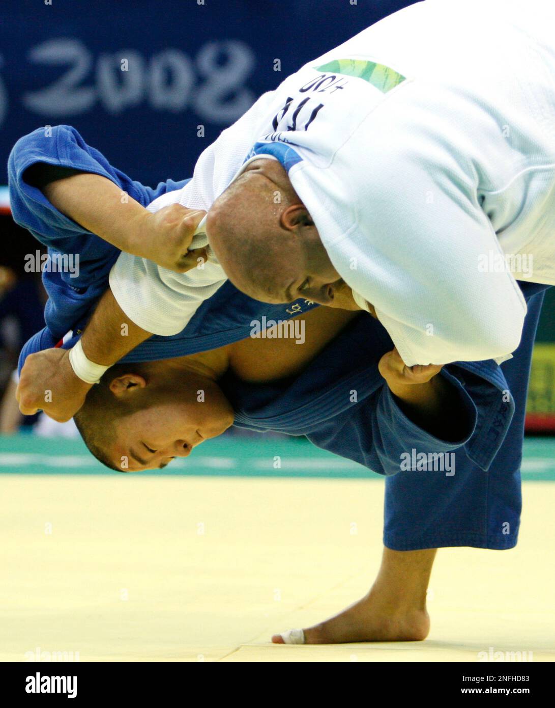 Japan's Satoshi Ishii, blue, throws Italy's Paolo Bianchessi of Italy ...