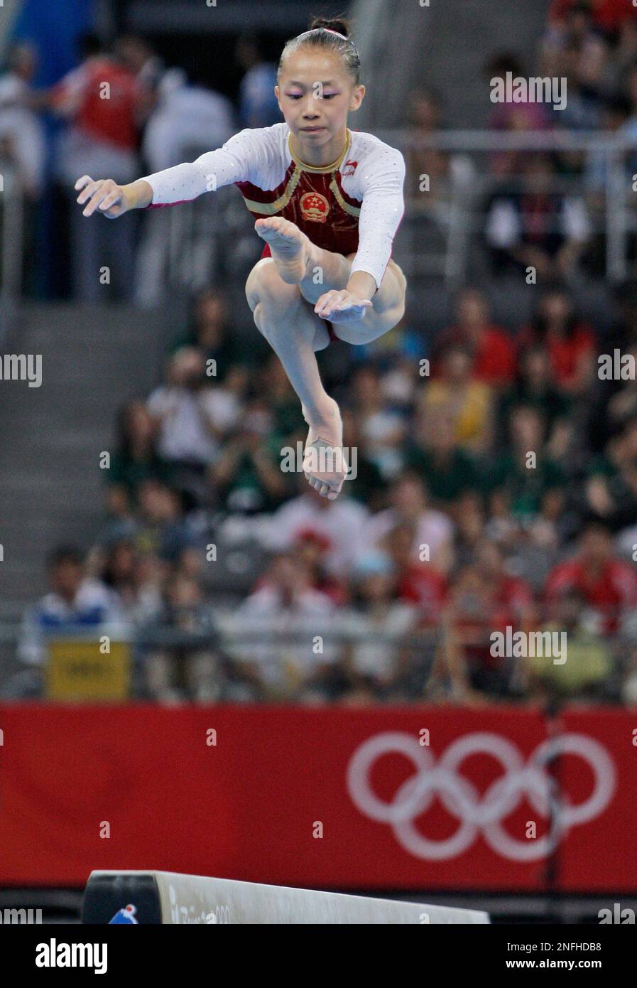 China's gymnast Yang Yilin performs on the balance beam during the ...