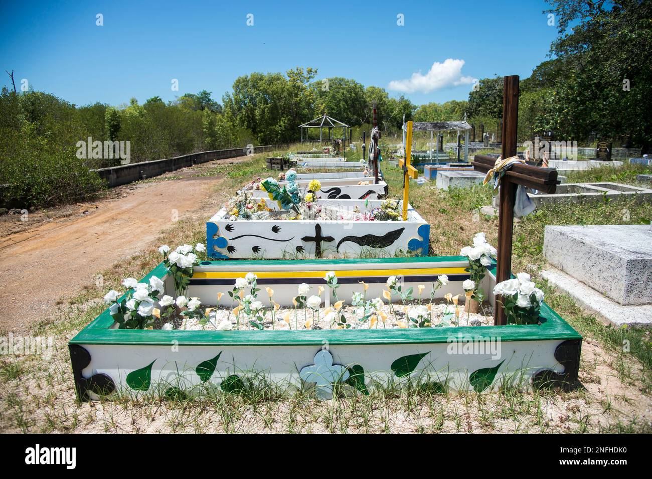 The Saibai Island cemetery is surrounded by a seawall on three sides on ...