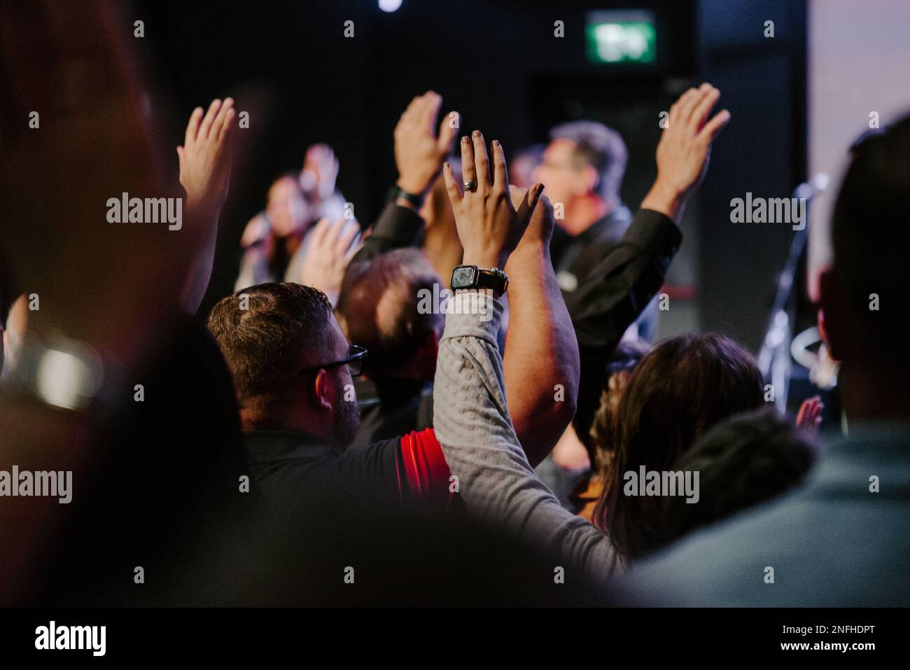 Hands in the air of people who praise God at church service Stock Photo ...
