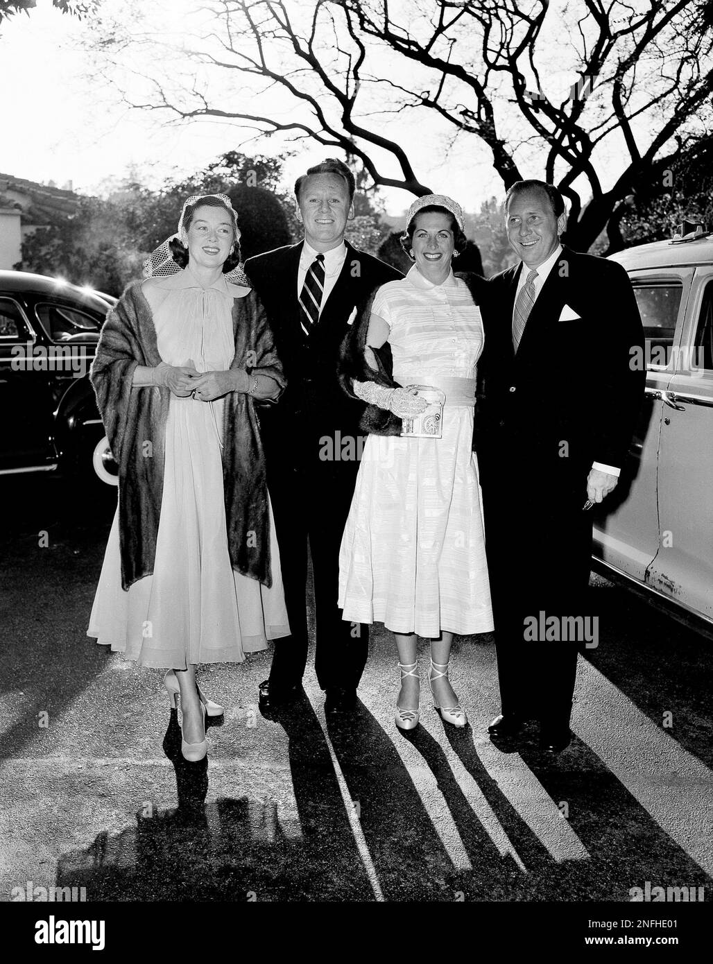Van Johnson (left) escorts his wife Evie, in white dress, and Freddie ...