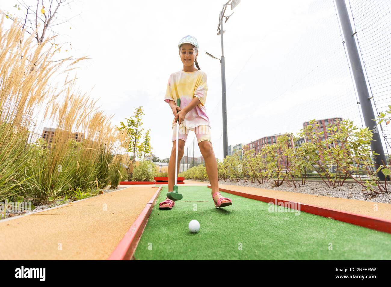 cute little girl on a miniature golf course Stock Photo - Alamy