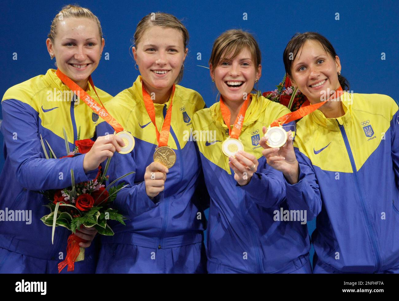 From left, Ukraine's Gold medal winners Olena Khomrova, Olga Kharlan ...