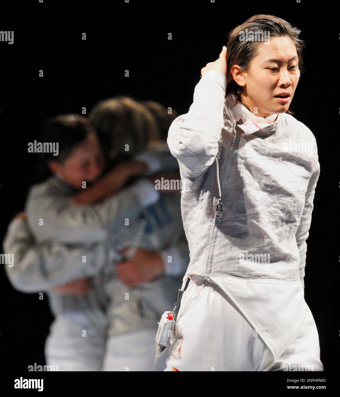 China's Tan Xue walks away after Ukraine won the women's team saber ...